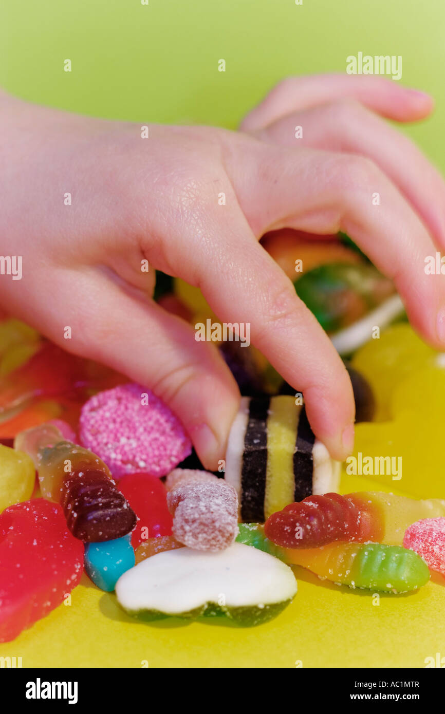 child's hand picking candies Stock Photo - Alamy