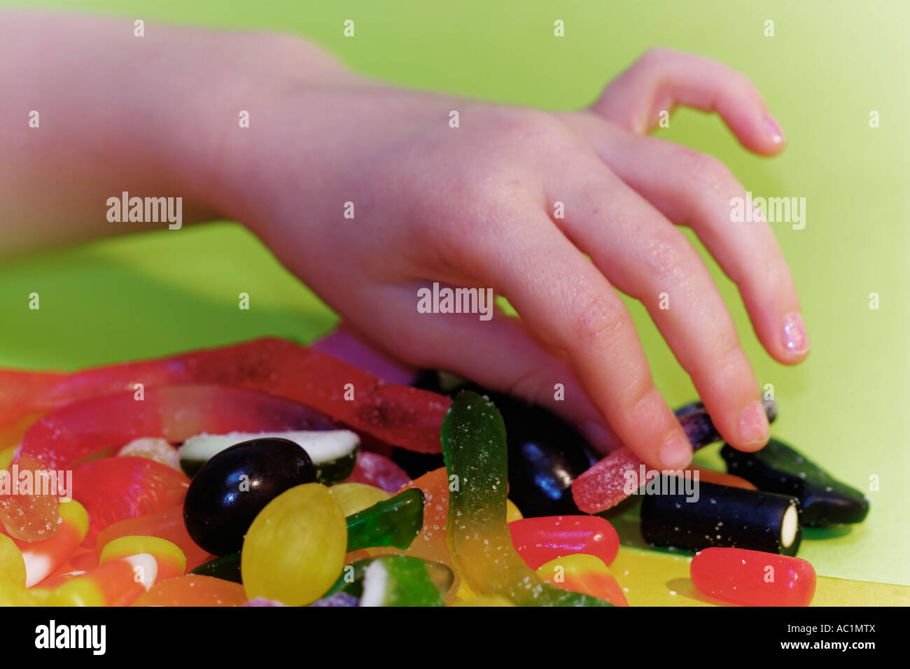child's hand picking candies Stock Photo - Alamy