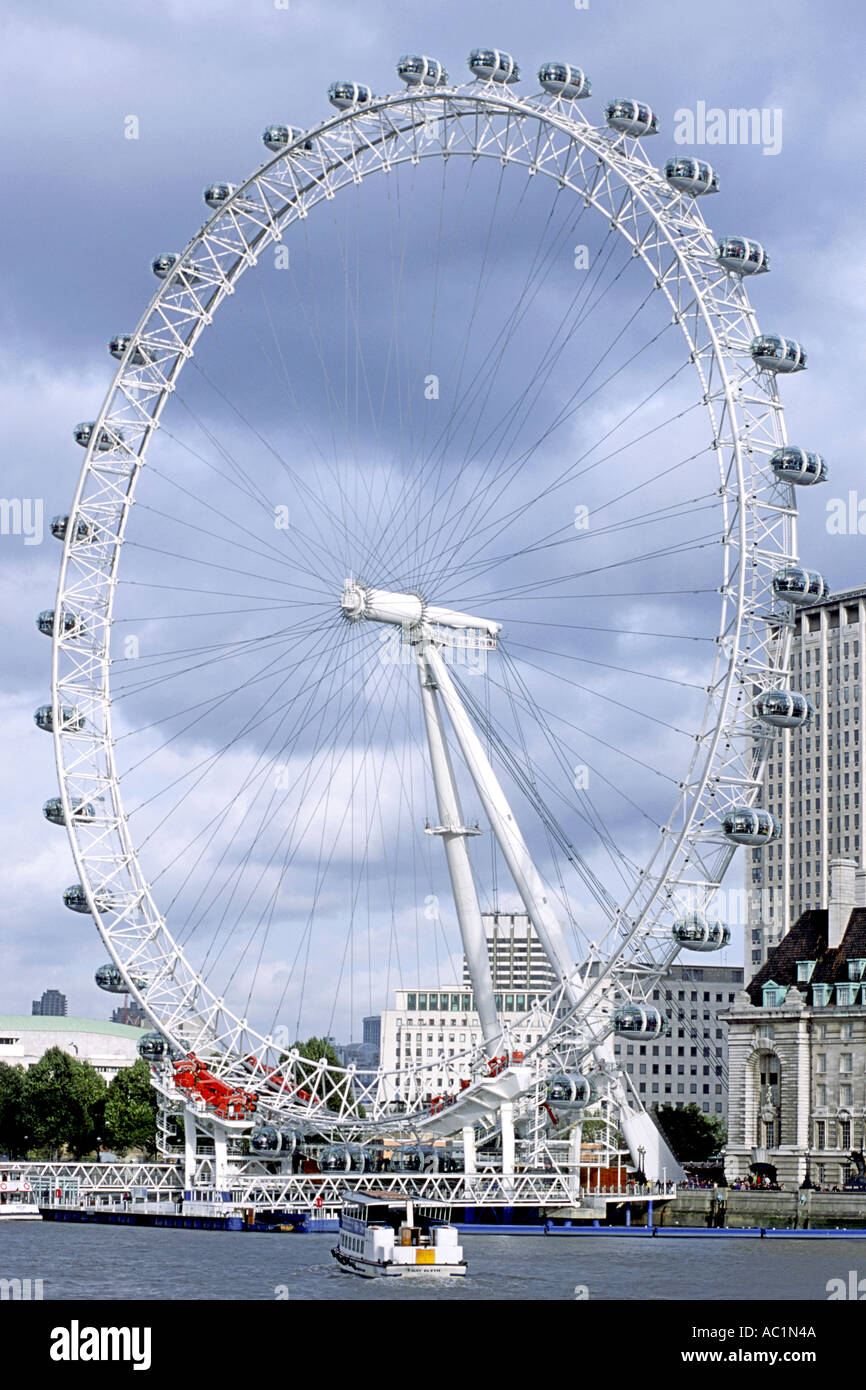 The London Eye (aka the Millenium Wheel) on the south bank of the Thames River in London Stock ...