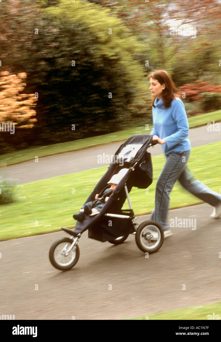 Old lady pushing stroller park baby happy woman hi-res stock ...
