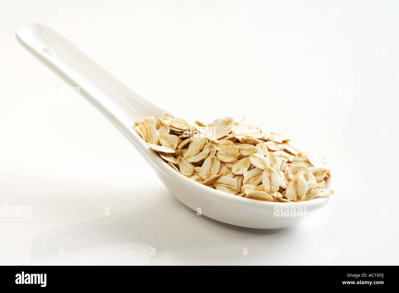 Whole grain oat flakes Stock Photo - Alamy