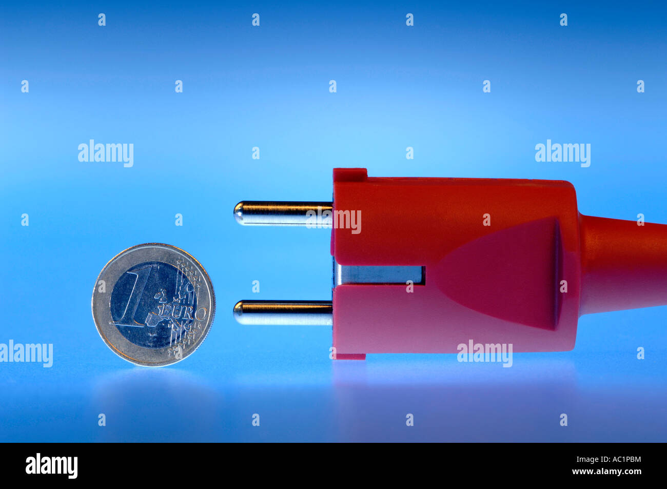 Electric plug and Euro coin Stock Photo - Alamy