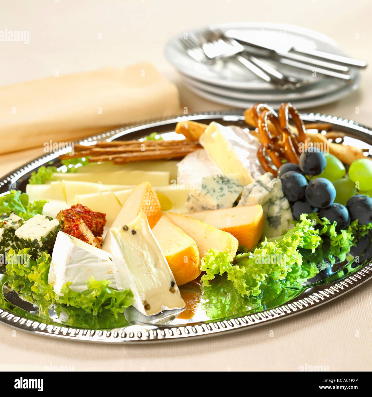 Various cheese on plate Stock Photo - Alamy