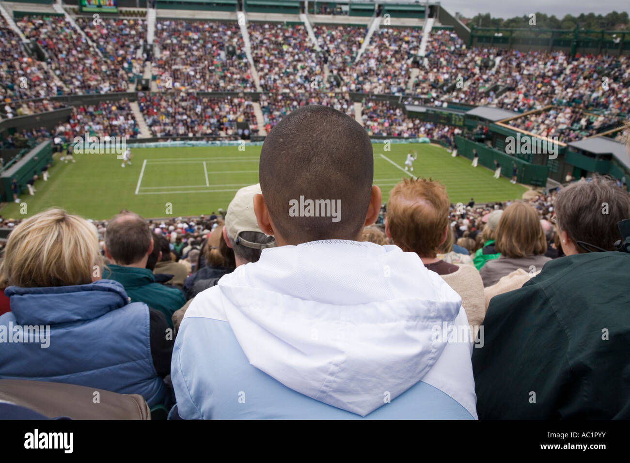 Spectators Watching A Tennis Volley