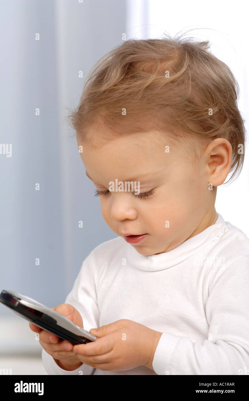 Little child using mobile phone, close-up Stock Photo - Alamy