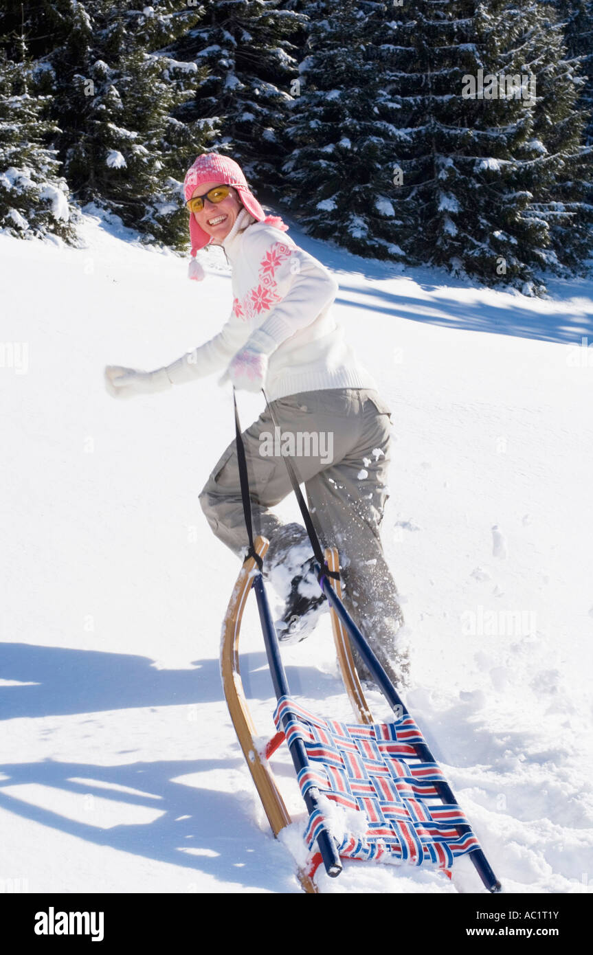 Woman pulling sledge Stock Photo - Alamy