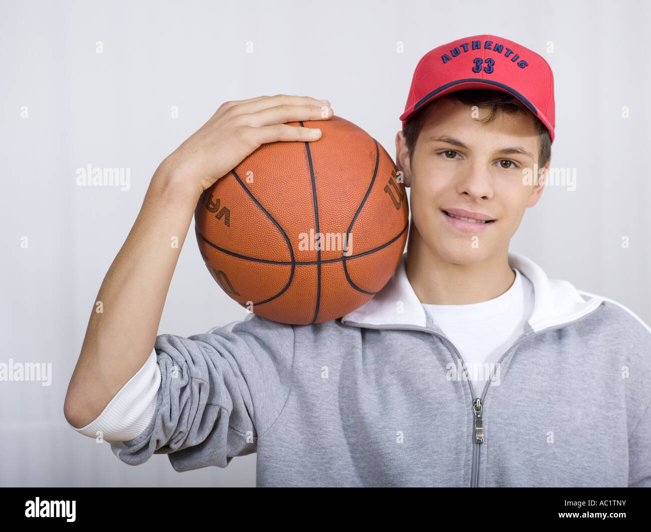 Boy ( 16-17) holding basket ball, portrait Stock Photo - Alamy