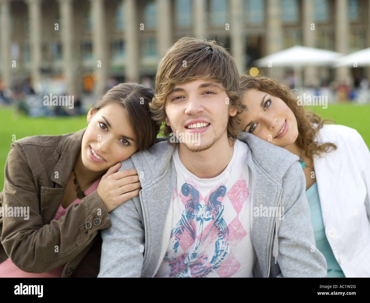 Germany, Stuttgart, young people sitting on bench Stock Photo - Alamy
