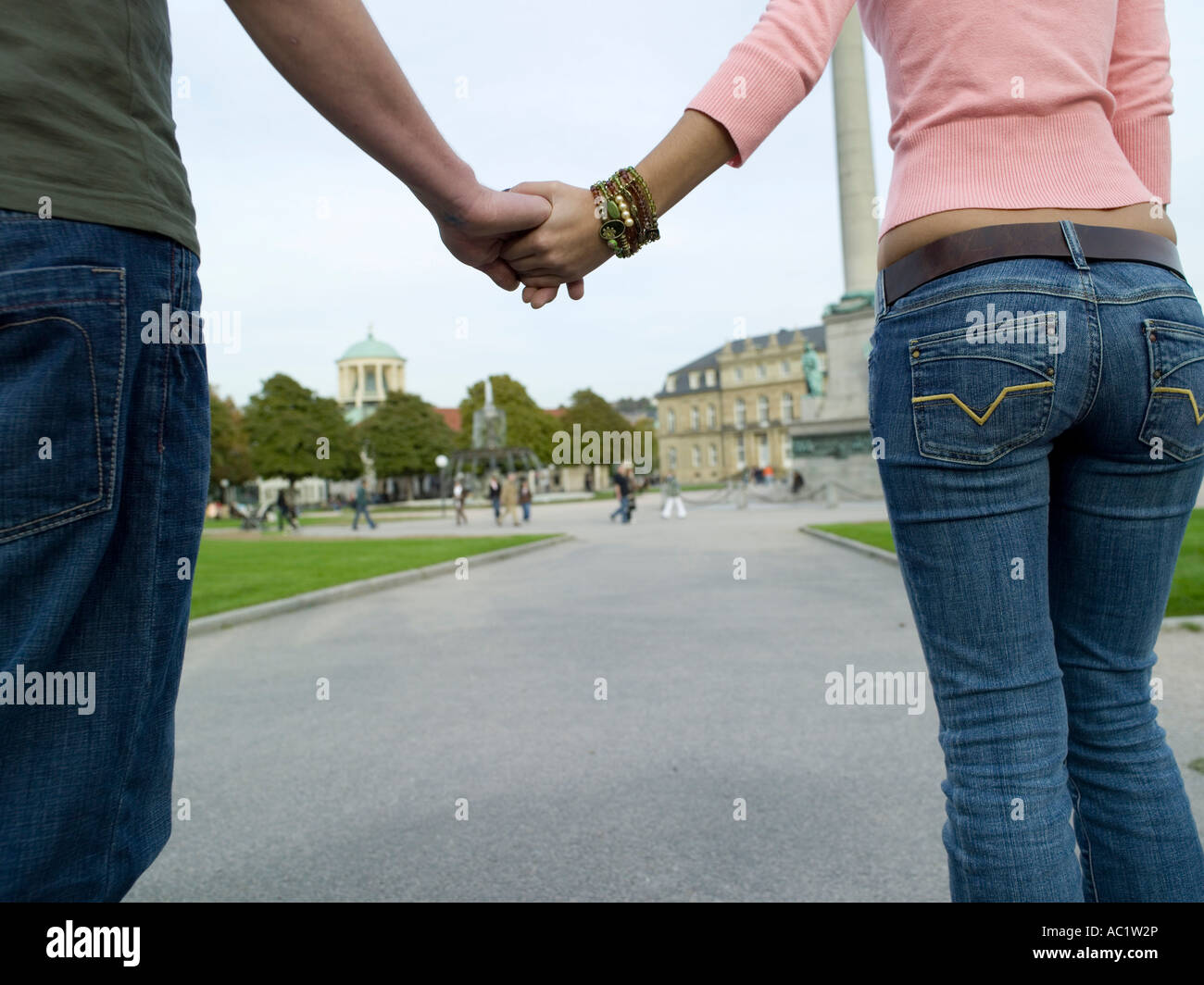 Germany; Stuttgart, couple walking hand in hand, rear biew Stock Photo ...