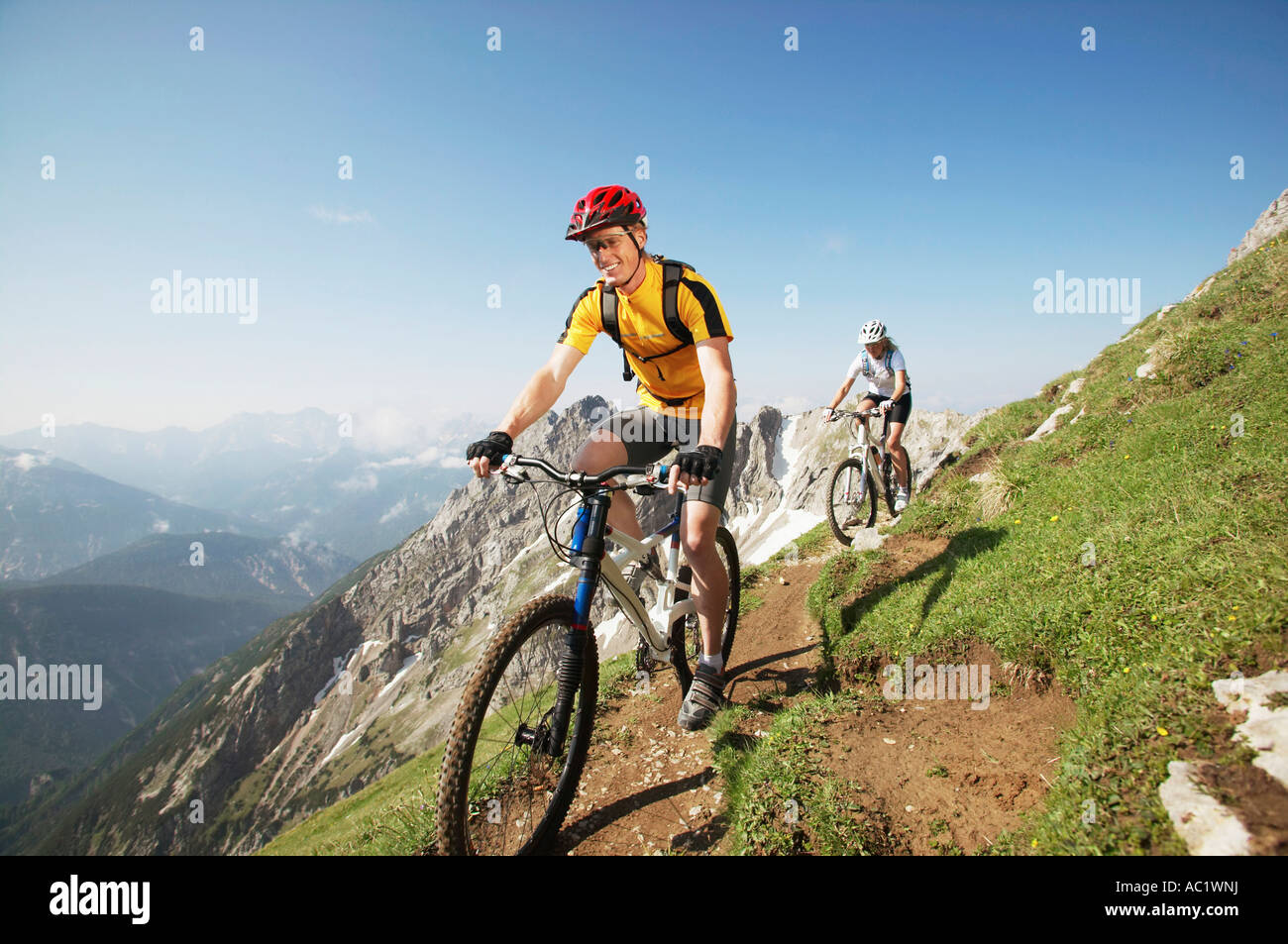 Mountain biking alps 2 people hi-res stock photography and images - Alamy