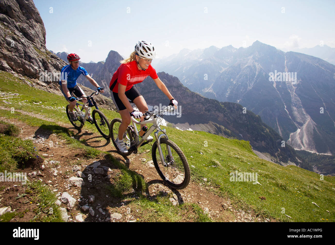 Mountain biking alps 2 people hi-res stock photography and images - Alamy