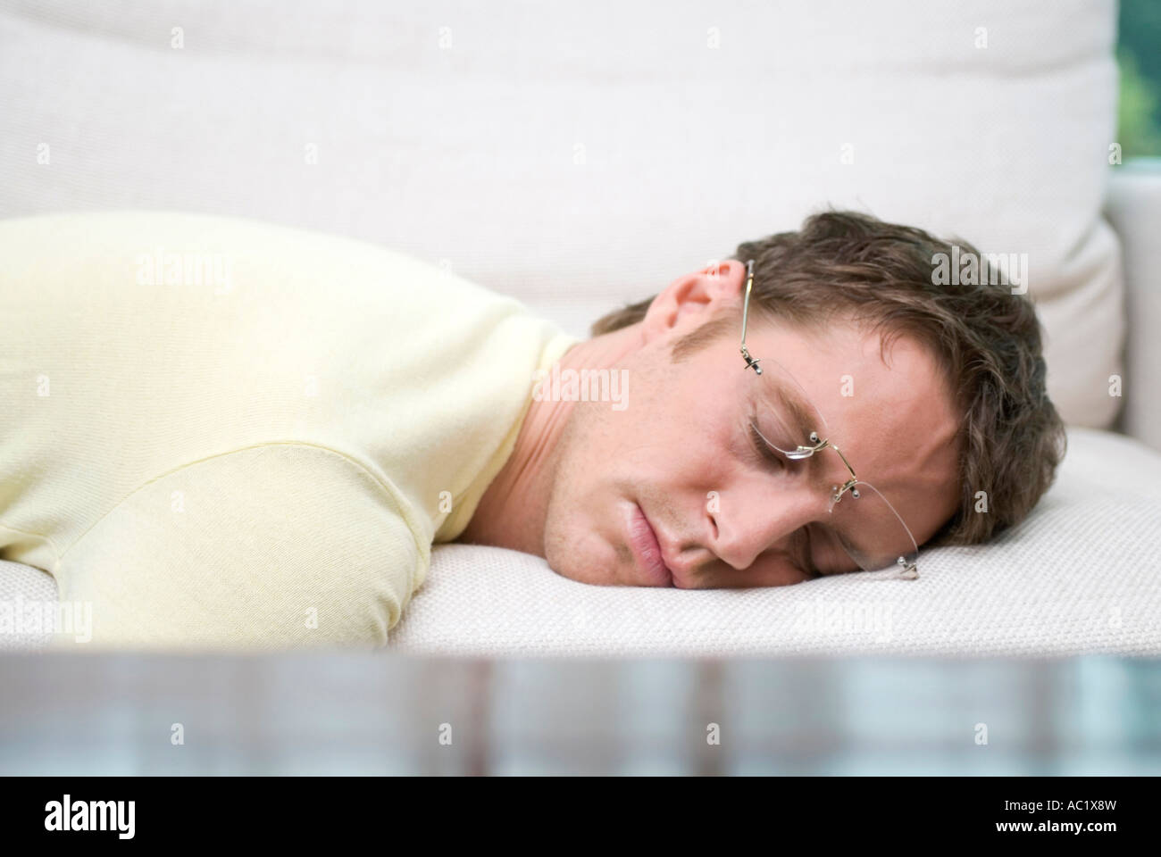 Man with spectacles sleeping peacefully Stock Photo - Alamy