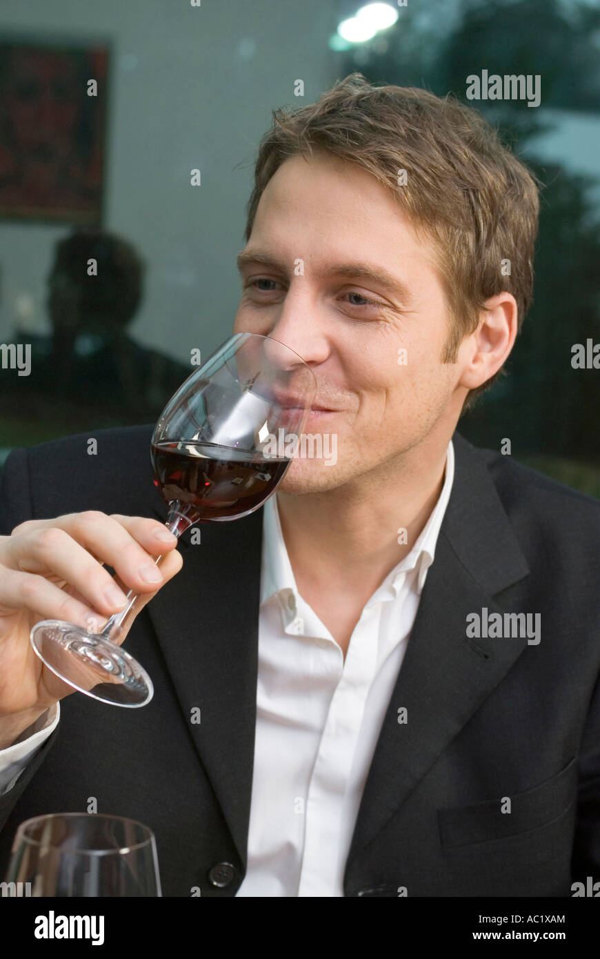 Man drinking red wine Stock Photo - Alamy