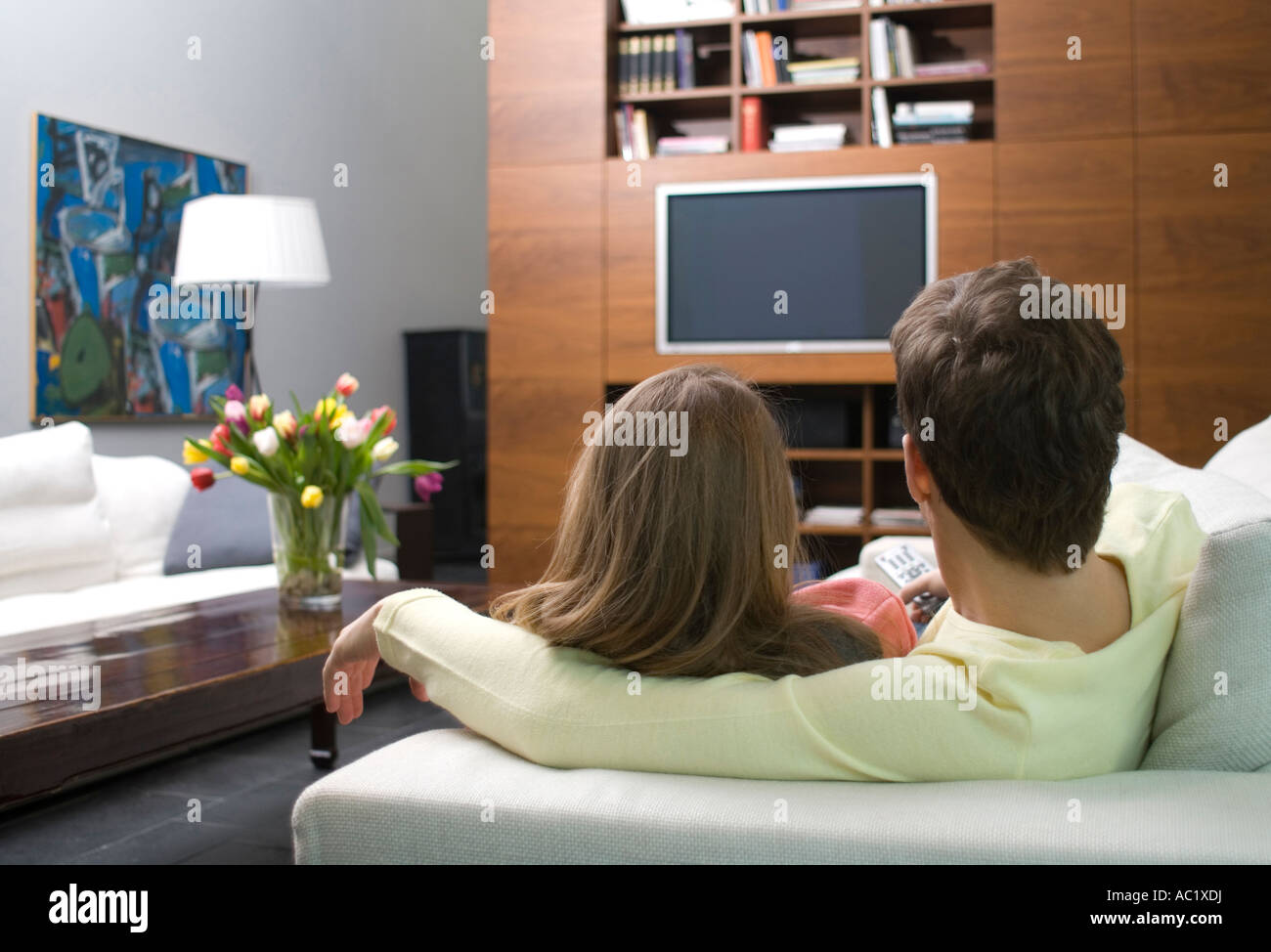 Couple watching TV Stock Photo - Alamy