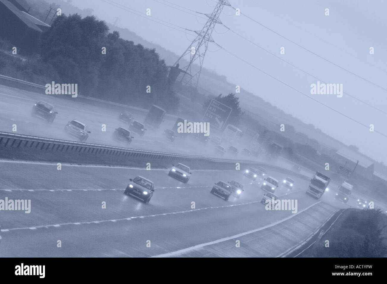 Motorway driving in heavy rain with spray dangerous driving conditions ...