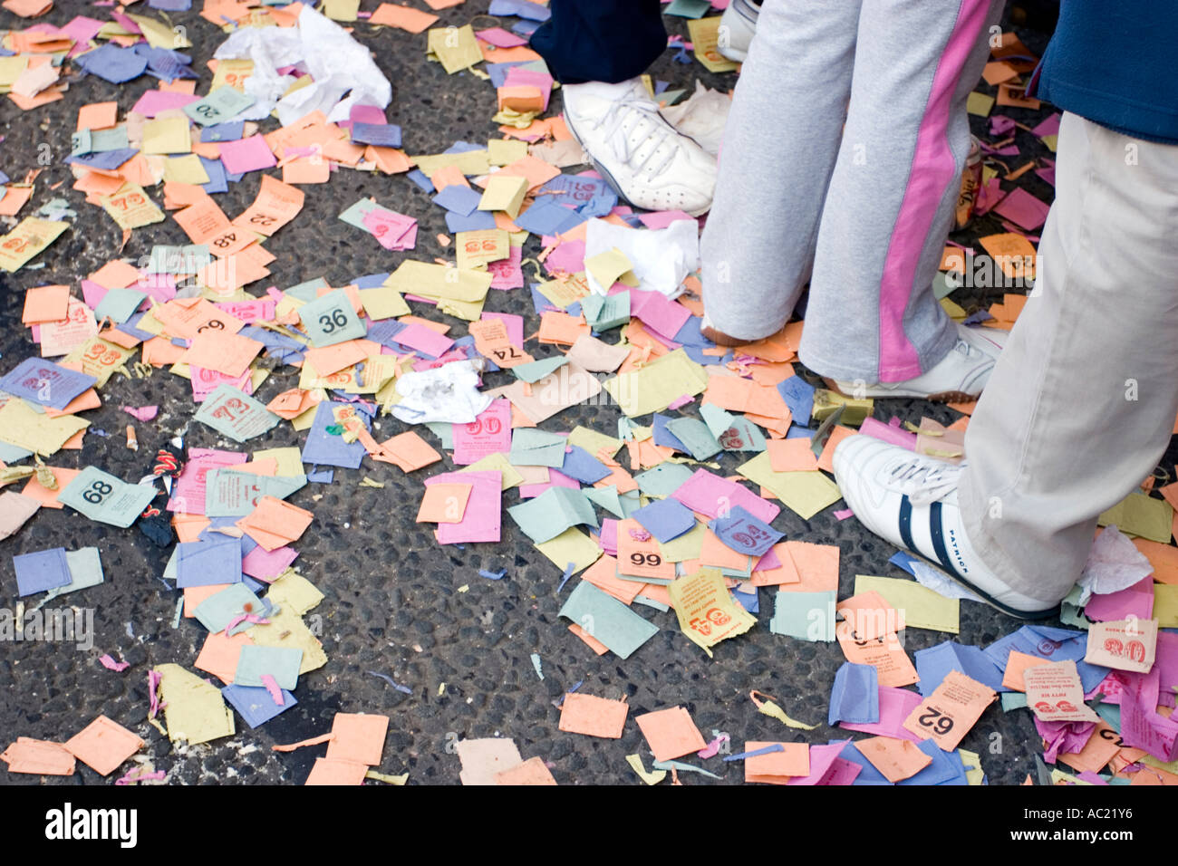 Lottery ticket litter trash on ground around fairground booth Stock ...