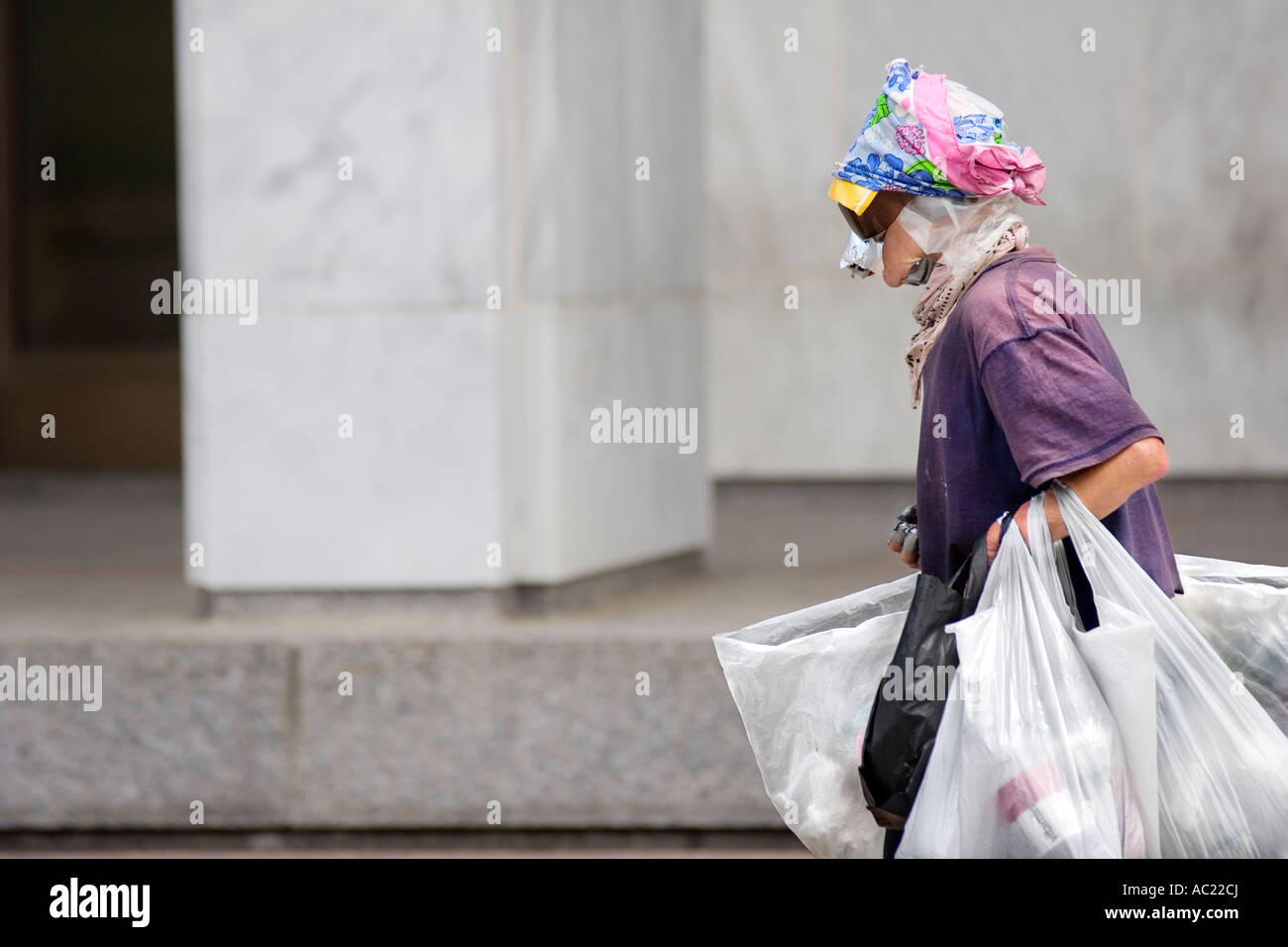 A homeless woman collects trash near the Capitol Building in Washington ...