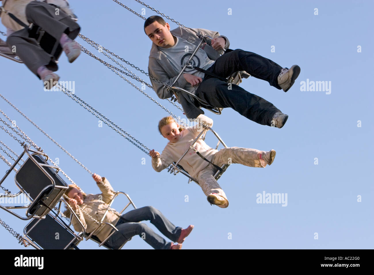 Spinning merrygoround carousel chairs Stock Photo - Alamy