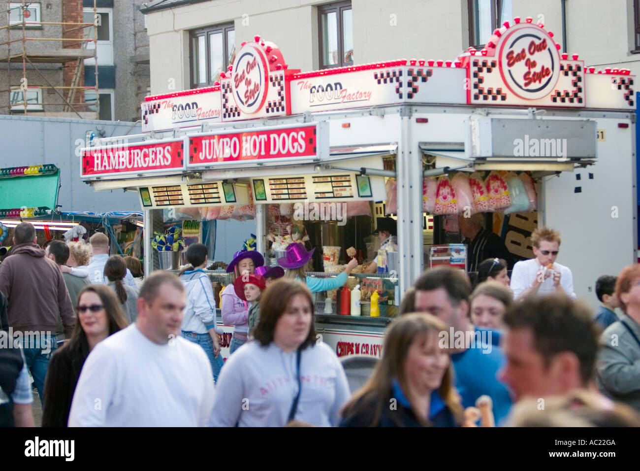 Fast food junk food stall at street fair Stock Photo - Alamy