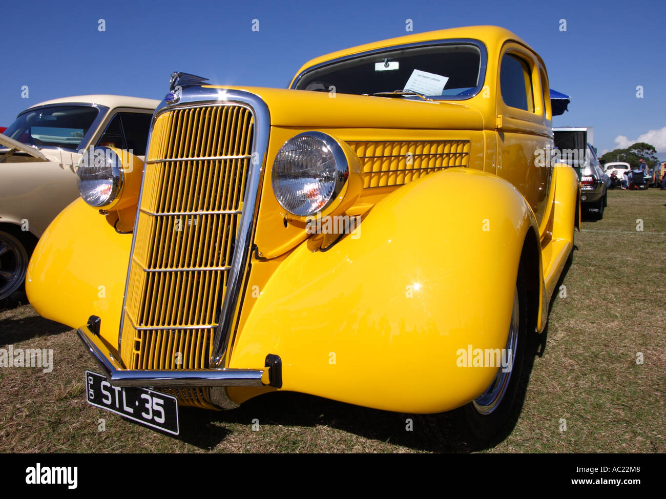 FRONT SIDE WIDE VIEW YELLOW FORD HORIZONTAL BAPDB7889 Stock Photo - Alamy