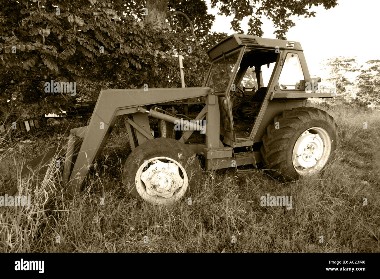 OLD RED TRACTOR ON A FARM SIDE VIEW HORIZONTAL SEPIA BAPD7773C Stock ...