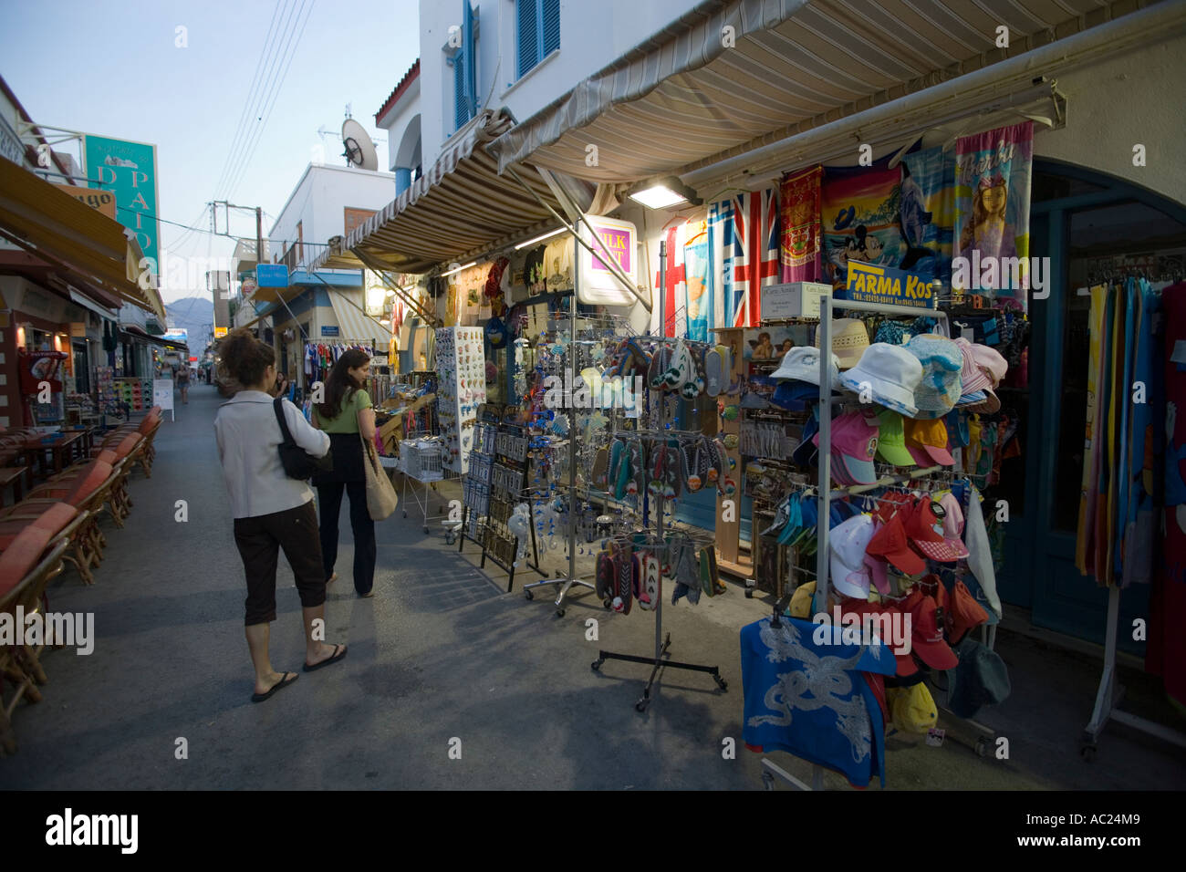 Two women during shopping tour Kardamena Kos Greece Stock Photo - Alamy
