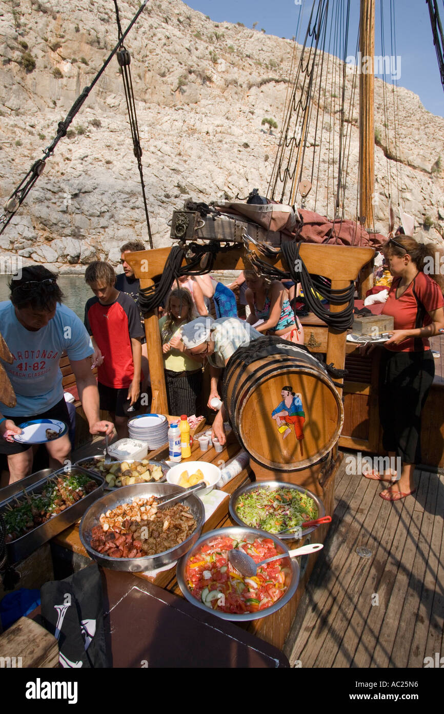 People using buffet on a sailing boat during a trip to a bay at ...