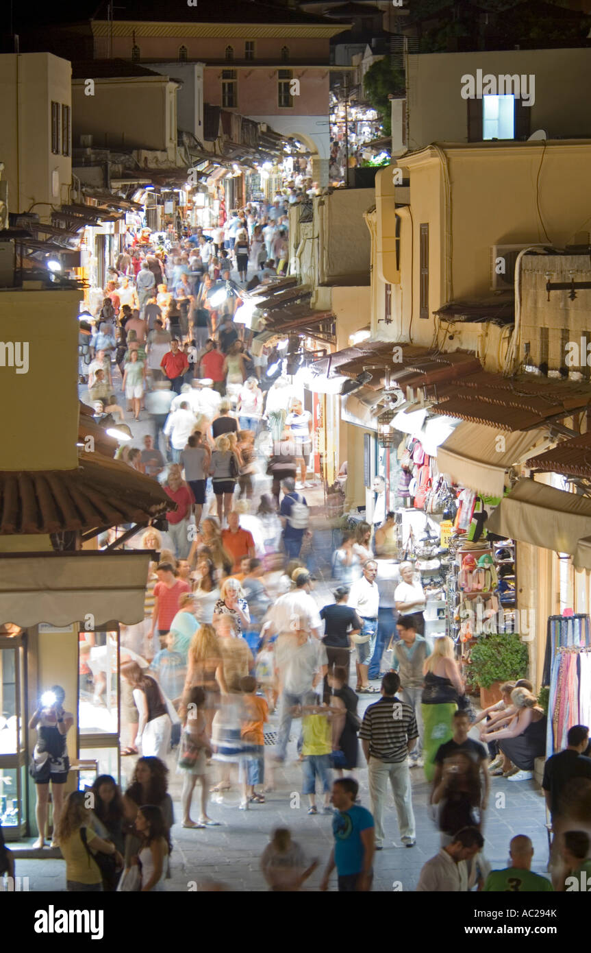 Compressed perspective evening night view of a shopping street in the ...