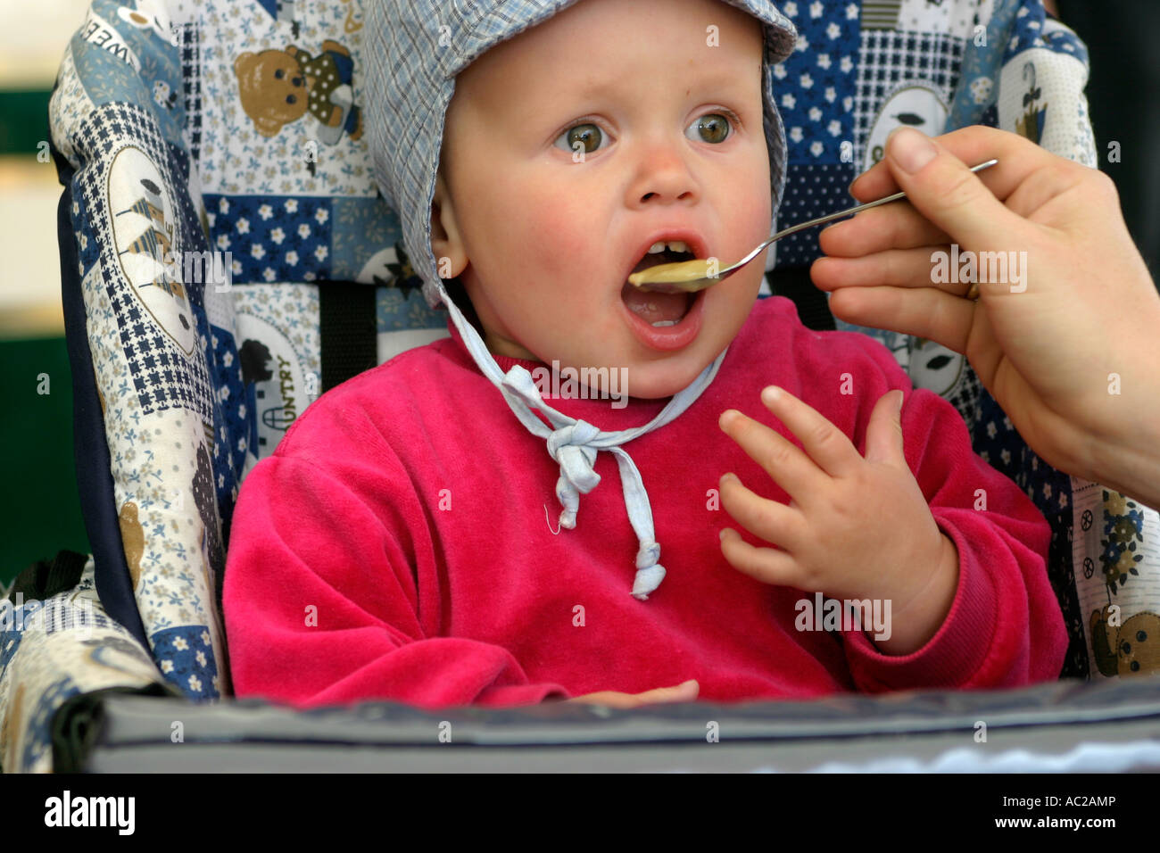 baby girl being fed Stock Photo - Alamy
