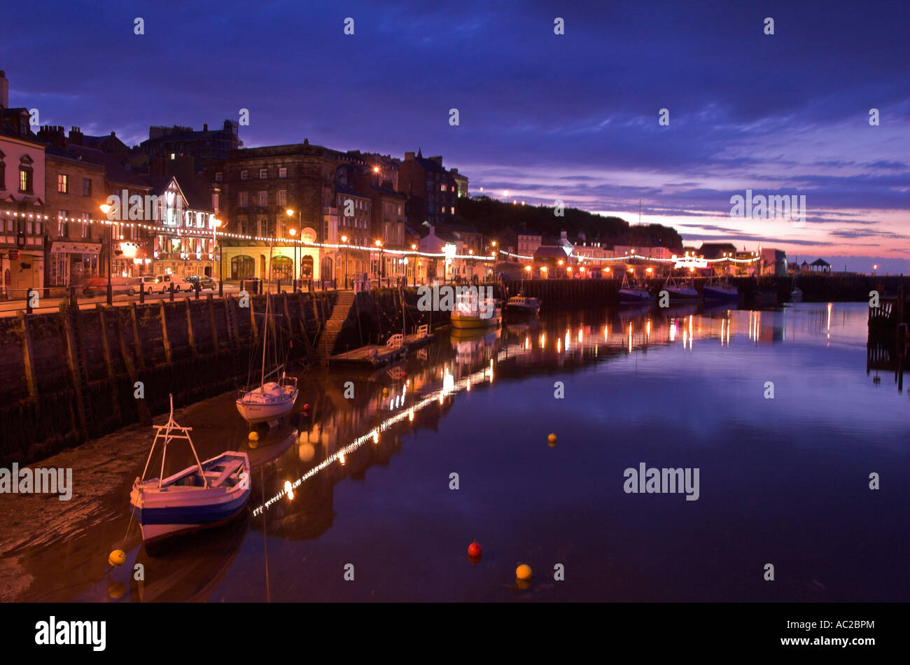Night Scene Whitby Harbour wall Whitby North East England UK Stock ...