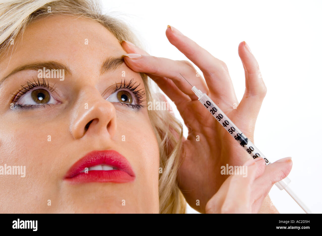 woman with botox and syringe Stock Photo - Alamy