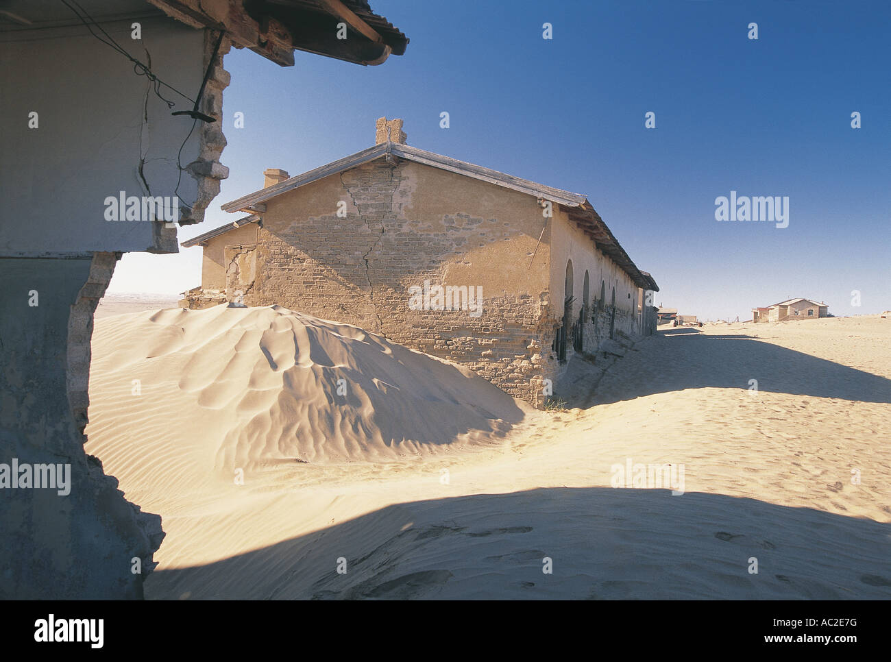 Abandoned houses engulfed by sand dunes in formerely luxurious ghost ...
