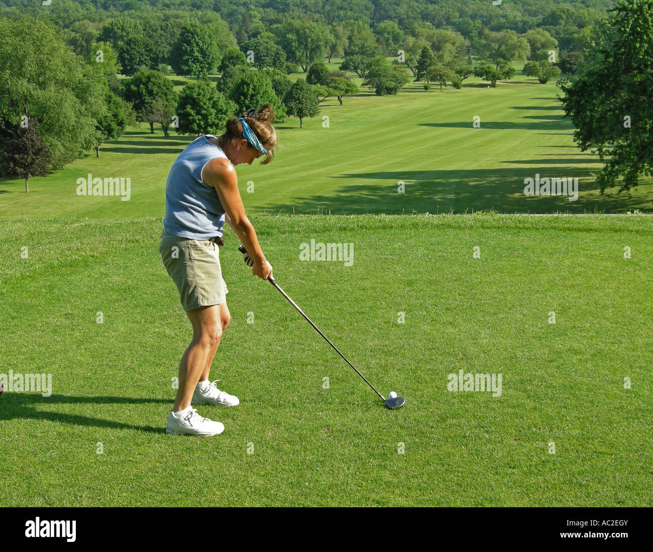 Female golfer driving golf ball hi-res stock photography and images - Alamy