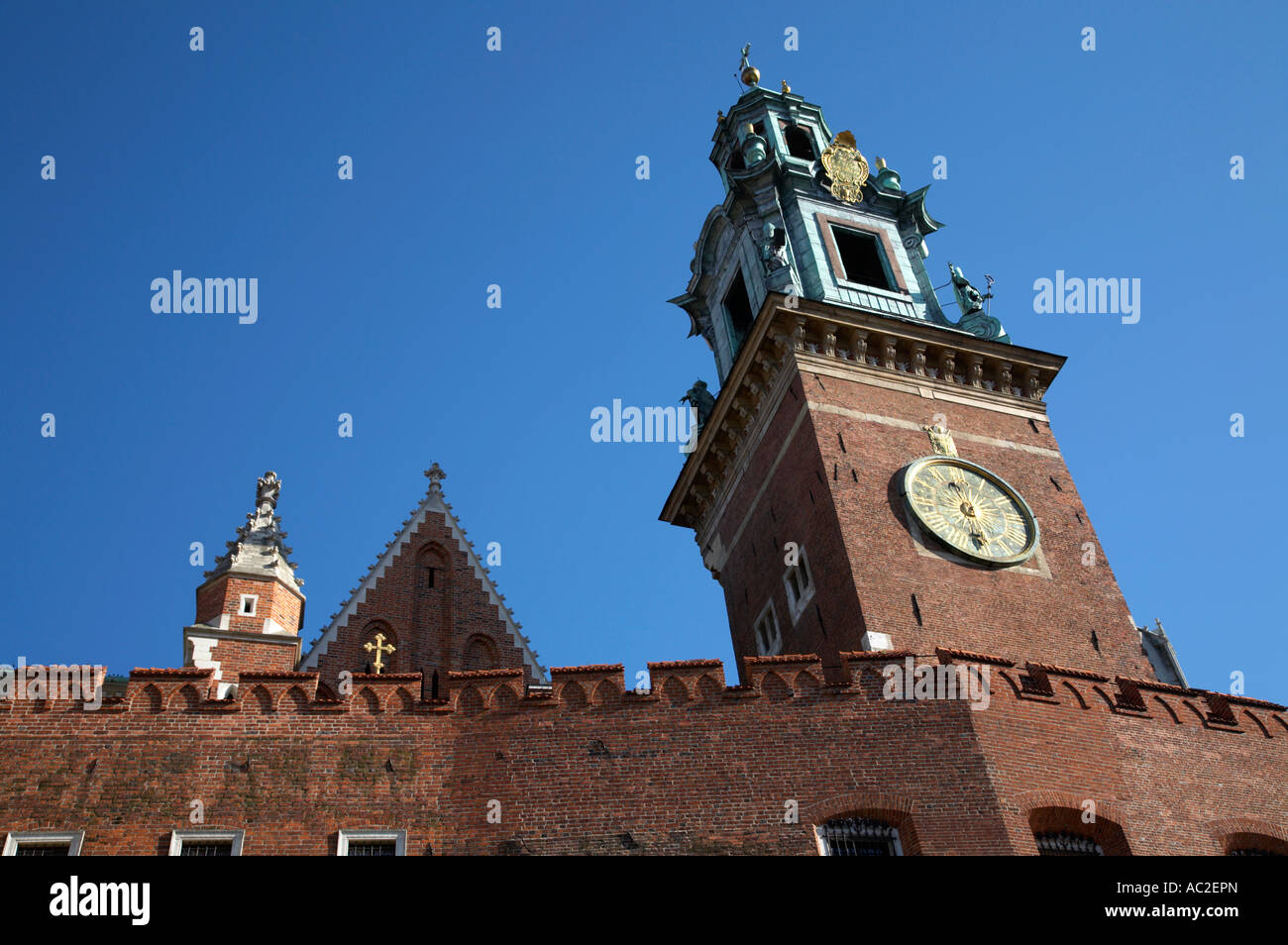 Wawel cathedral clock tower and fortified castle red brick walls at the ...