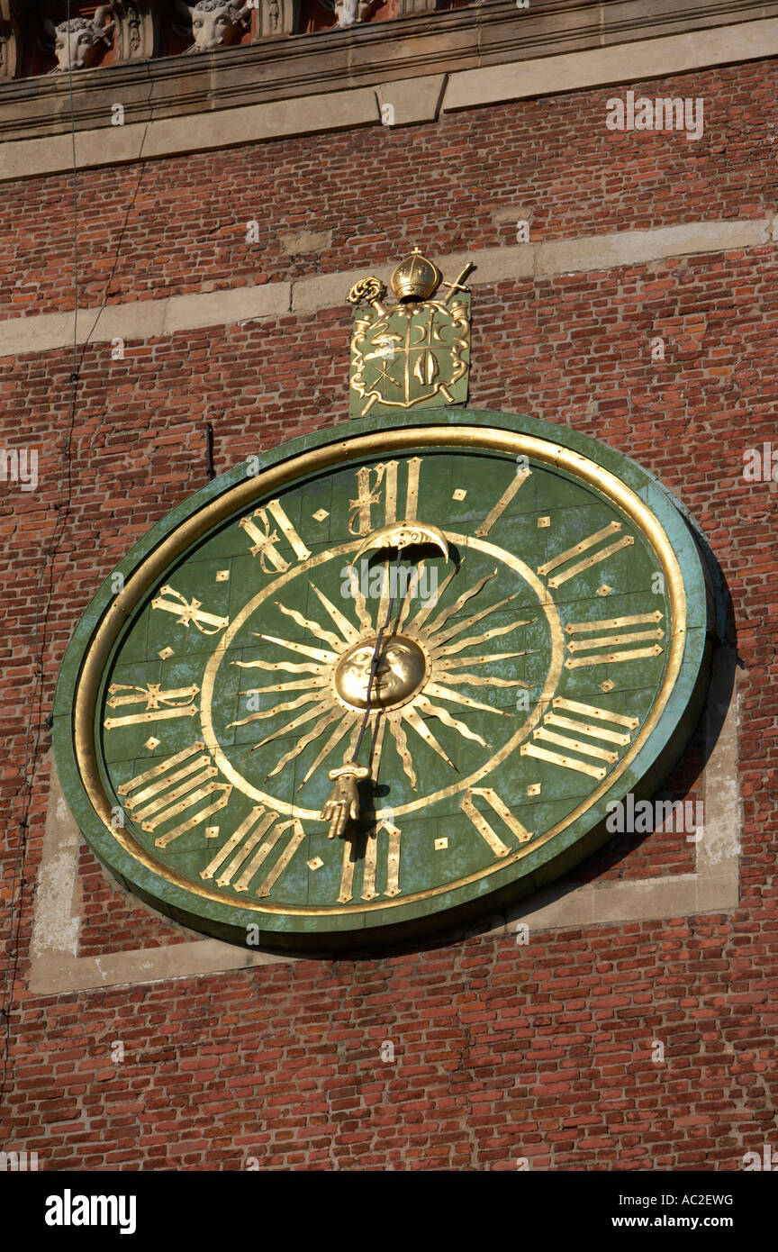 single hand clock face on the red brick clock tower of wawel cathedral ...