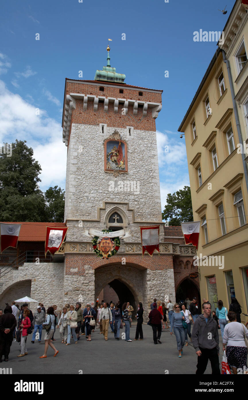 tourists and visitors at the Florianska Gate old city entrance to ...