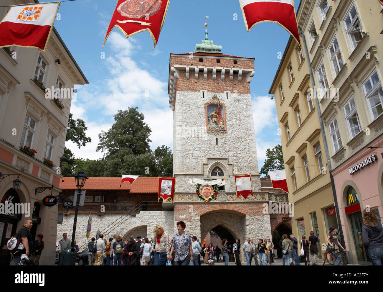 tourists and visitors at the Florianska Gate old city entrance to ...