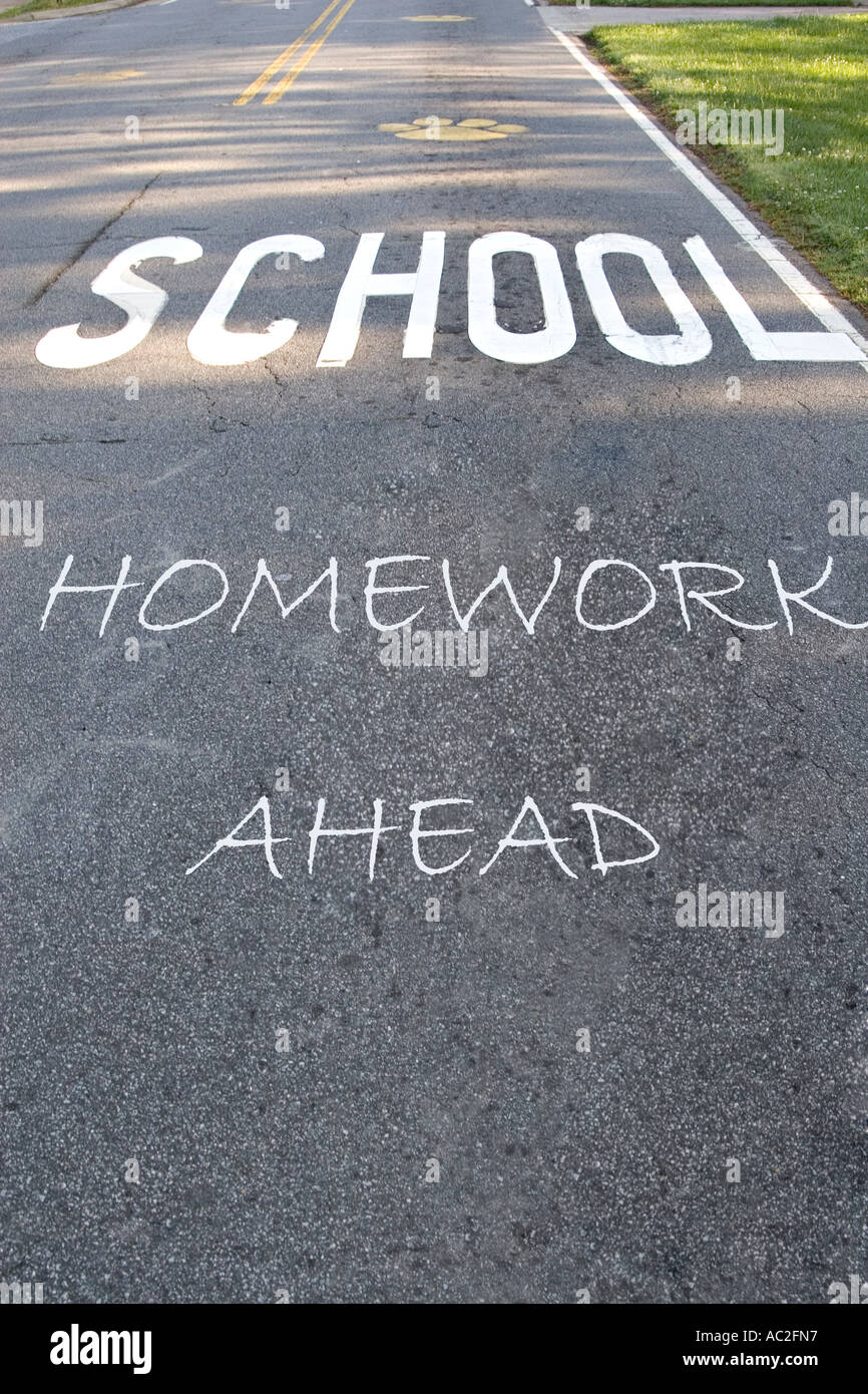 Stock photo of a school zone sign on the road with the words Homework ...