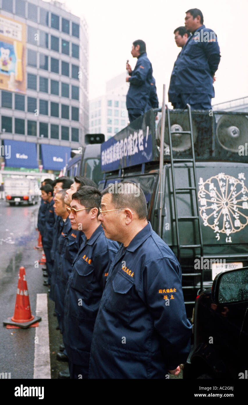 Right-wing Uyoku Dantai during a rally in the rain outside Shinjuku ...