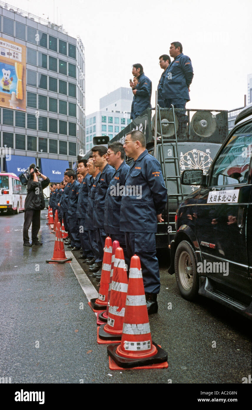 Right-wing Uyoku Dantai during a rally in the rain outside Shinjuku ...