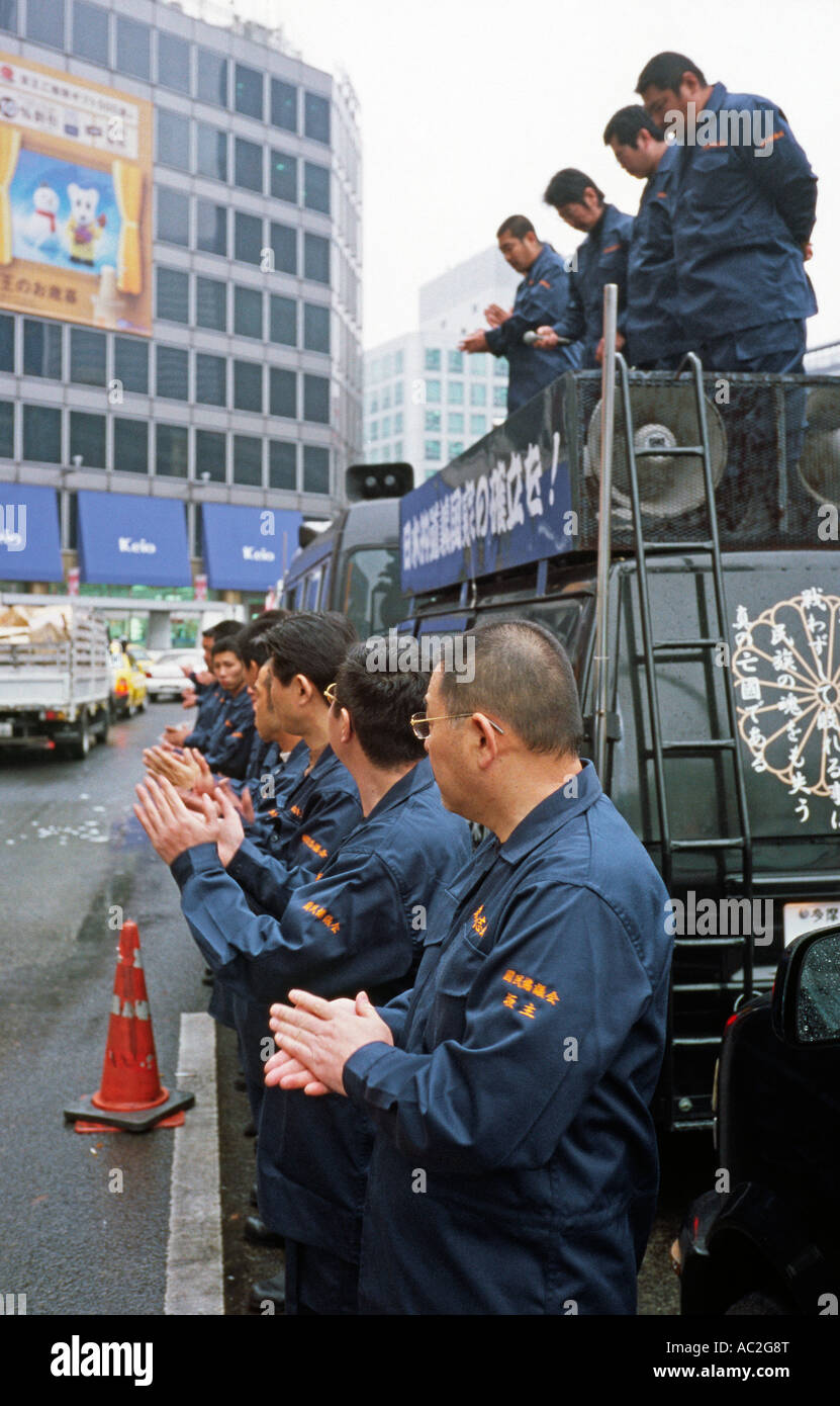 Right-wing Uyoku Dantai during a rally in the rain outside Shinjuku ...