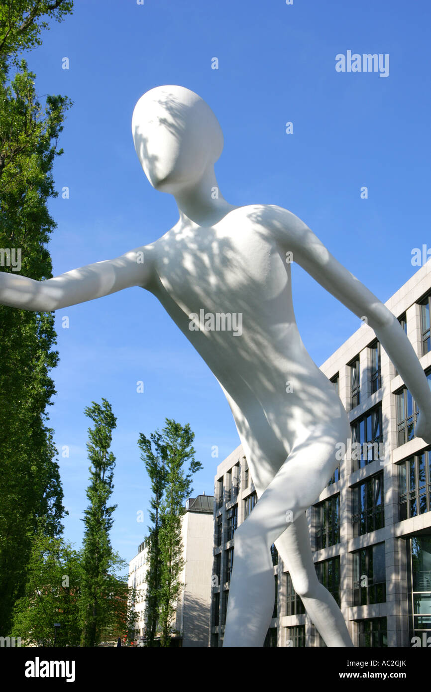 Walking man sculpture in munich hi-res stock photography and images - Alamy