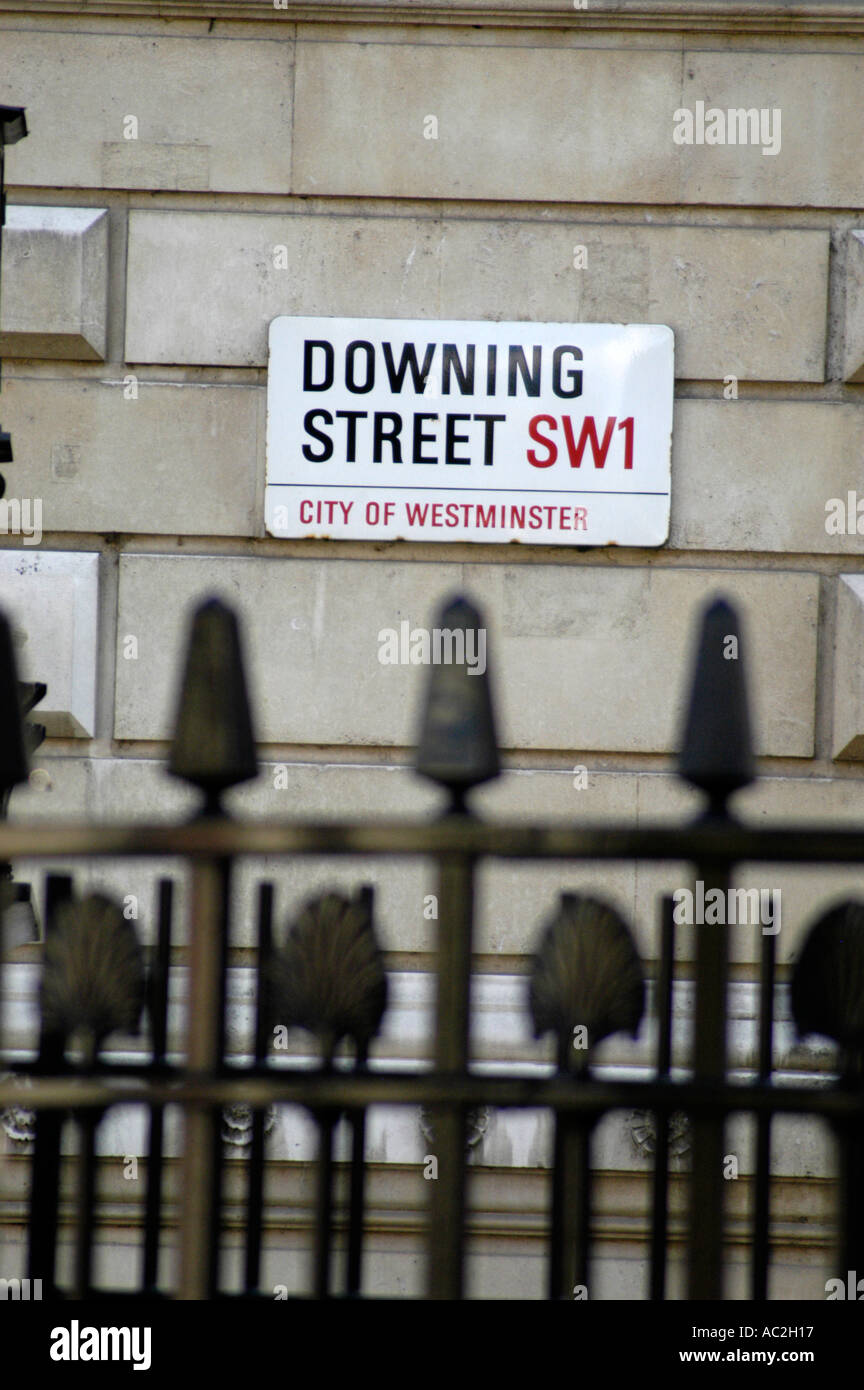 Downing Street sign behind railings Westminster London England Britain ...