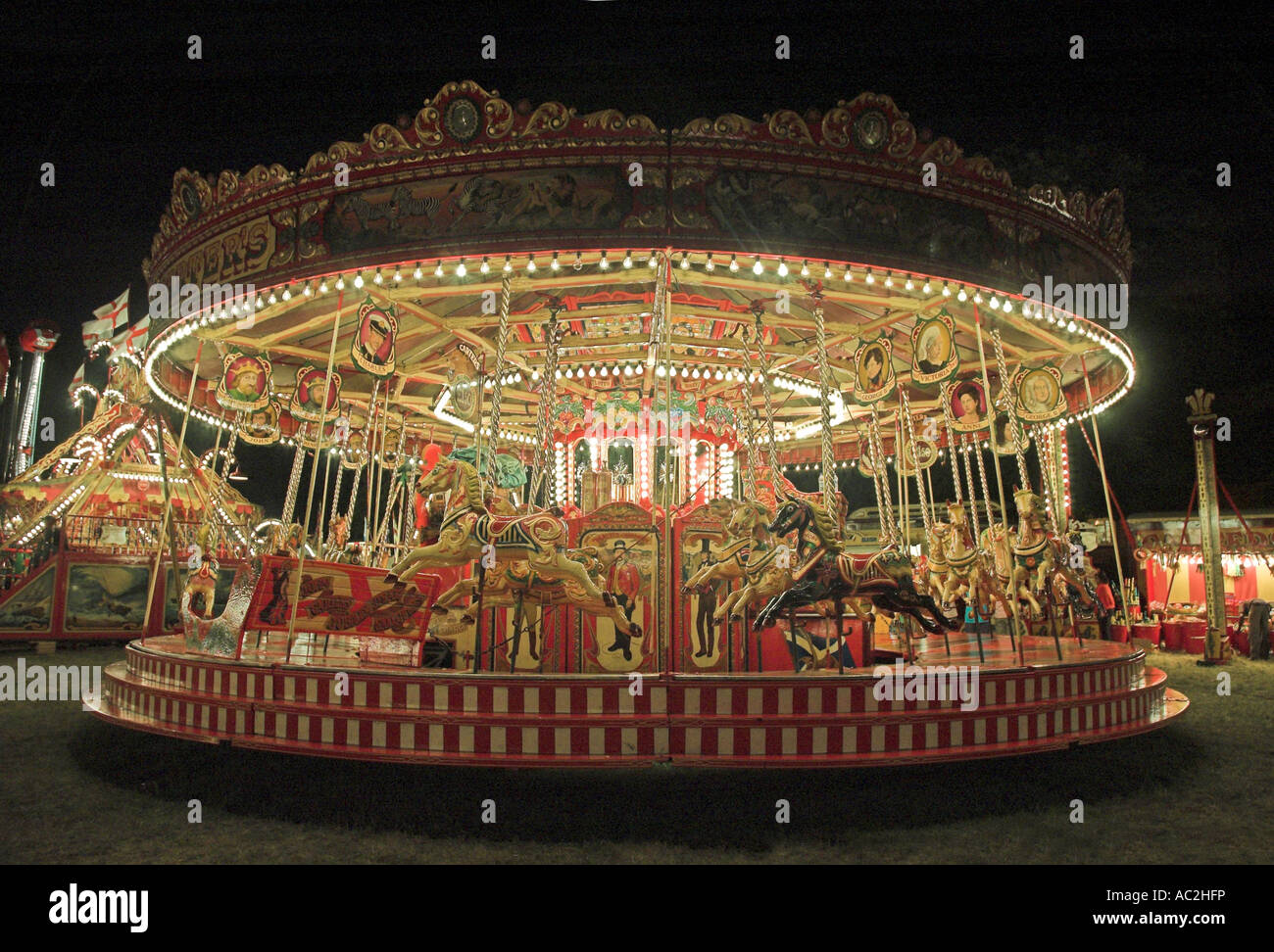 Carousel lit at night Stock Photo - Alamy