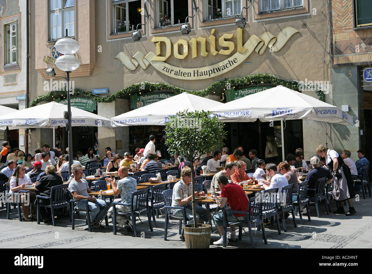 Germany Bavaria Munich People sitting outside the popular Donisl ...