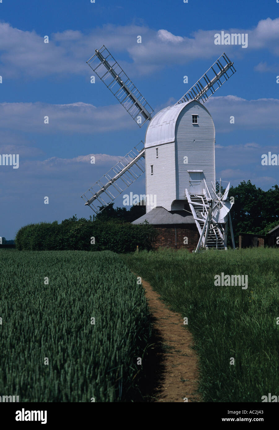White weather boarded Post Mill with Fan Tail on turning beam Village ...