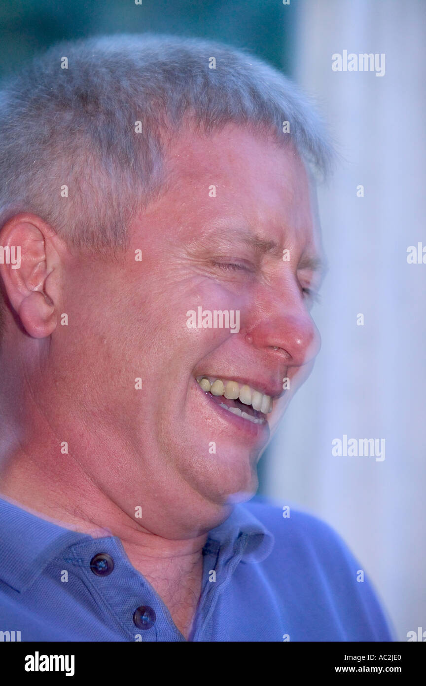 man laughing uncontrollably Stock Photo - Alamy