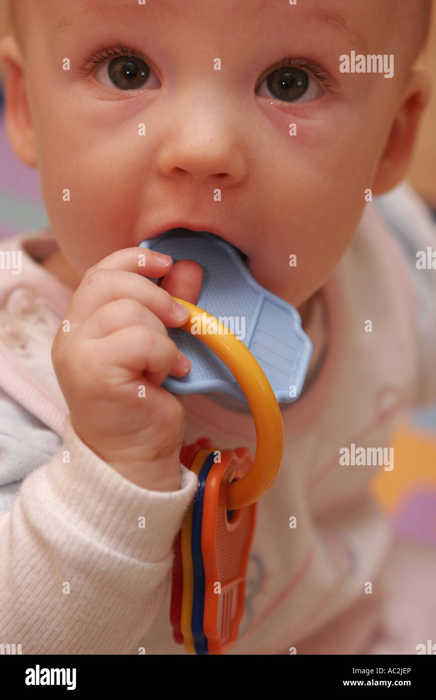 Baby hand holding rattle toy detail hi-res stock photography and images ...