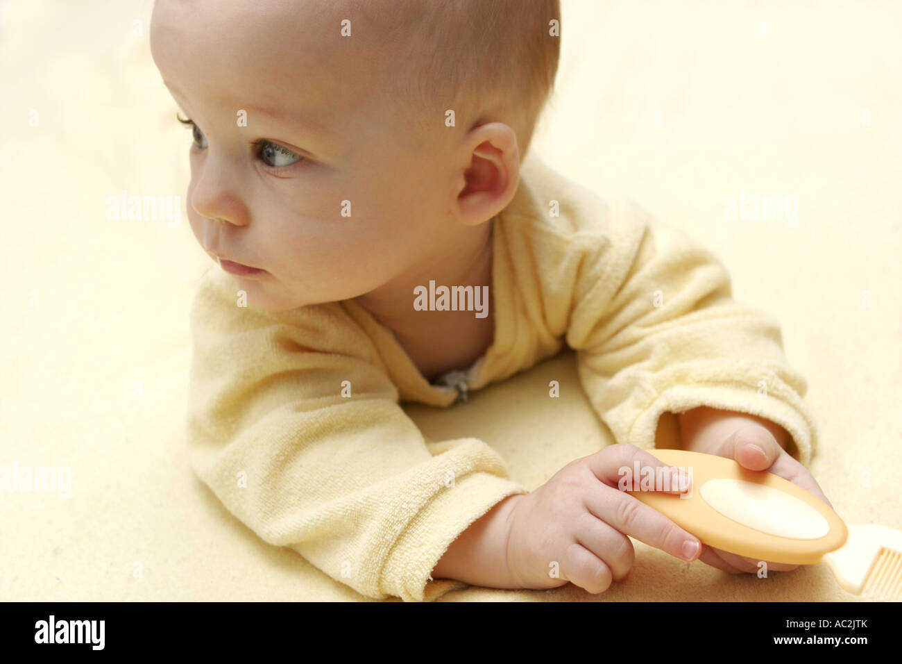Portrait of baby with comb Stock Photo - Alamy