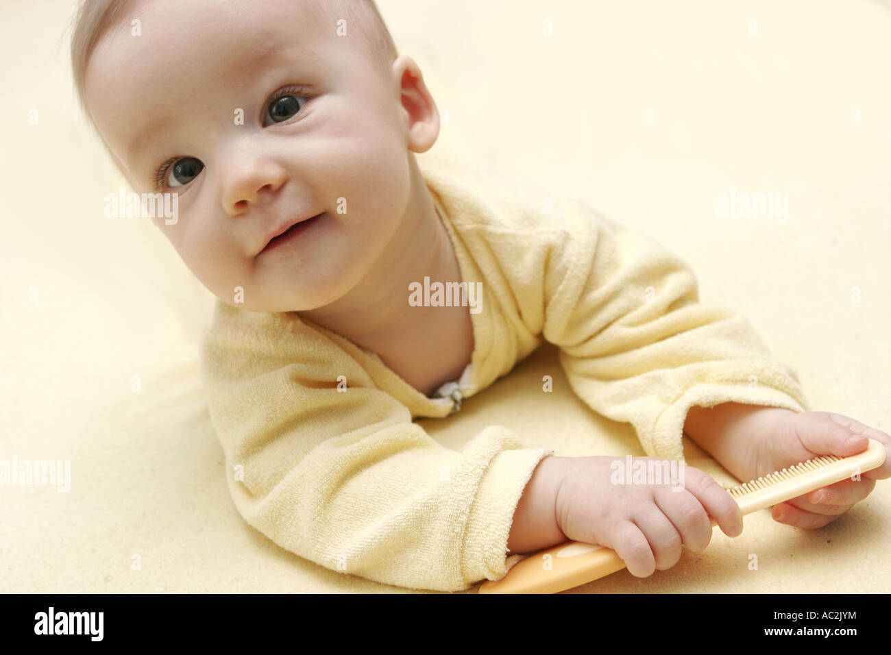 Portrait of baby with comb Stock Photo - Alamy
